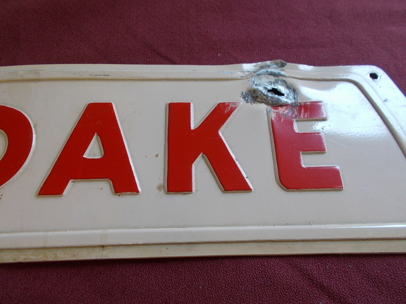 VINTAGE DAKE SIGN ADVERTIZING STORE GAS OIL ICE CREAM EMBOSSED NAME TAG ...