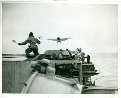 British Martlet fighter plane landing on HMS Illustrious, 1942 ...