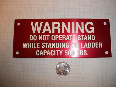 Warning sign.500lb capacity. Do not operate stand while standing on ...