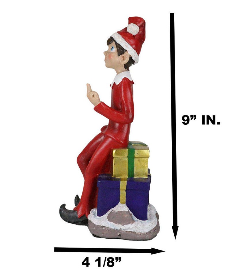Naughty Christmas Elf Flipping The Bird Sitting On Santa Presents Shelf ...