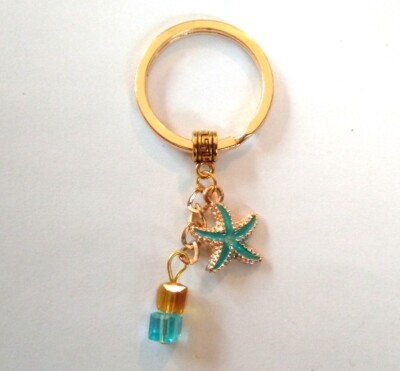 Porte Clé / Bijou de sac Etoile de Mer Cubes Bleu et or | eBay