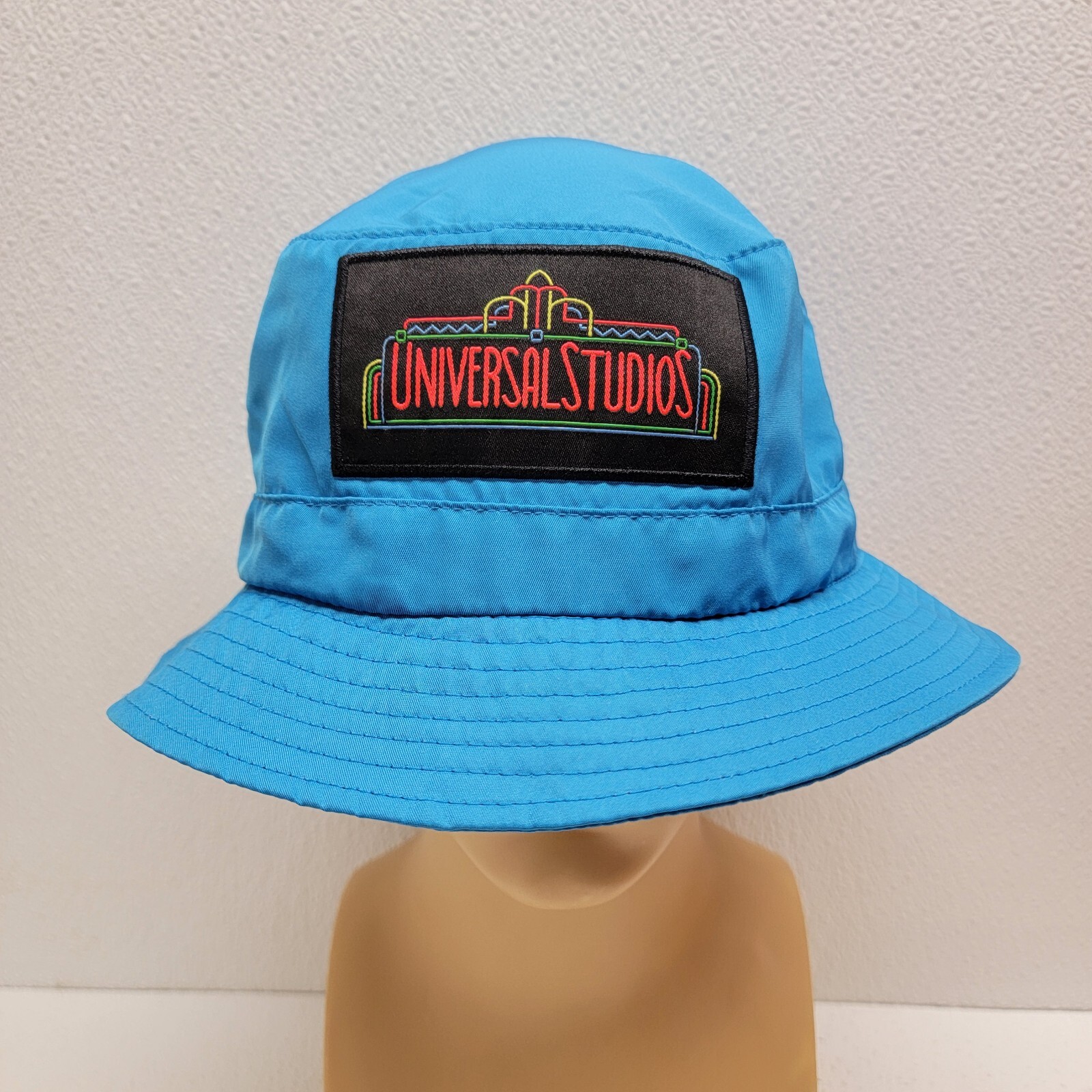 Universal Studios Neon Blue Retro Logo Bucket Hat One… - Gem
