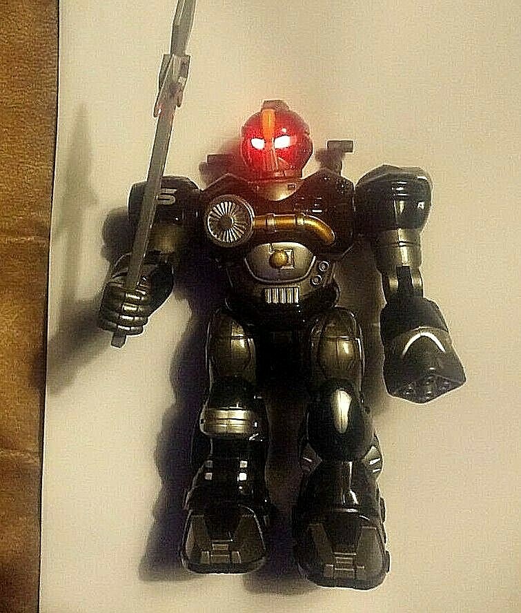 Light Up Red Eyes Toy Robot ,complete with weapon and batteries inside ...