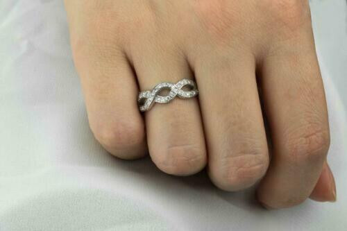 Classic Infinity Design With Round Shiny White Gemstone Engagement ...