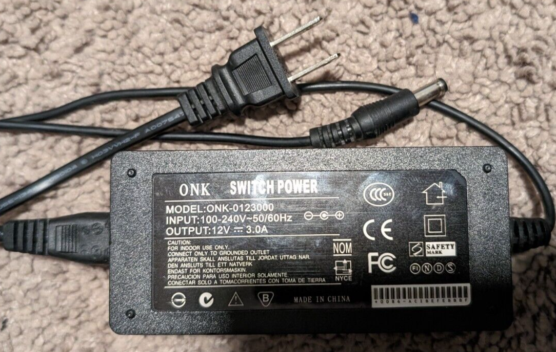 AC/DC Adapter Model ONK-0123000 120VAC 12VDC 60Hz 36W 3A Power supply ...