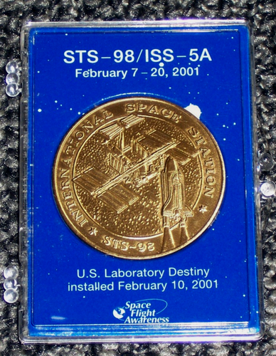This coin was made from the US Laboratory Module Flown on mission STS ...