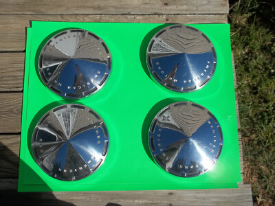 1970 ? 1972? amc 14 or 15 inch SS hubcaps very nice wheel covers ...