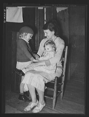 Mrs. Bagget and two children. Wife of sharecropper near Laurel ...