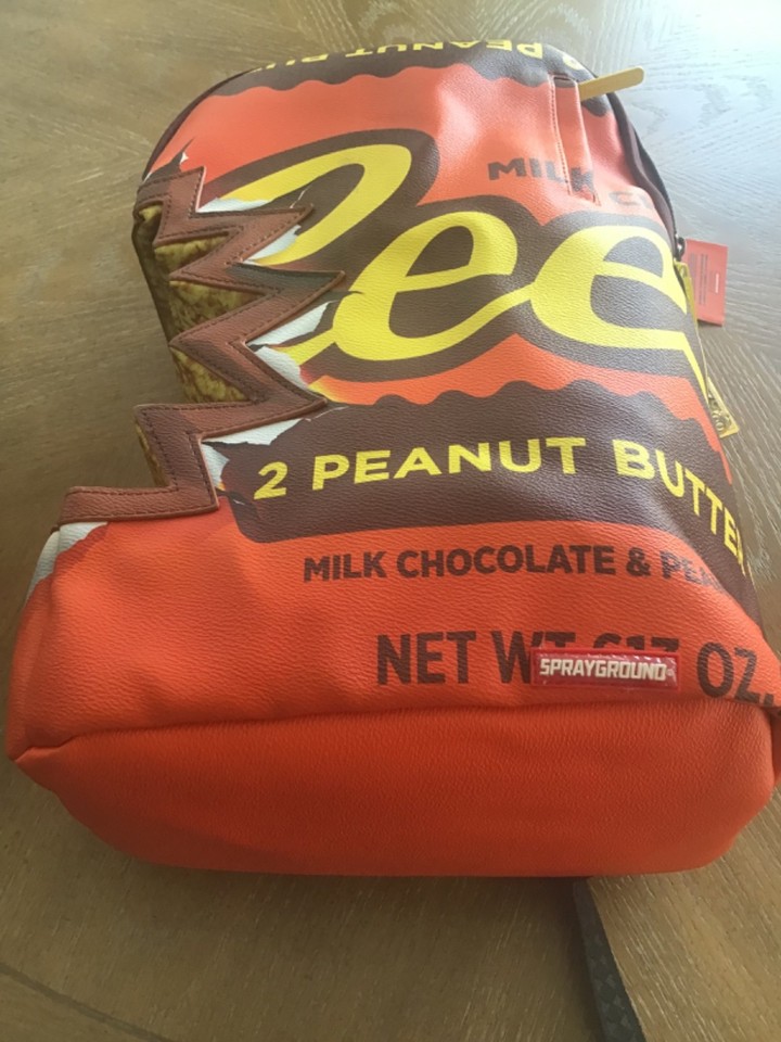 Reese's Sprayground Shark bite Backpack NWT | eBay