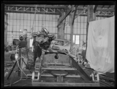 Engine being hoisted into Wizard Smith's car in a warehouse, NSW, - Old ...