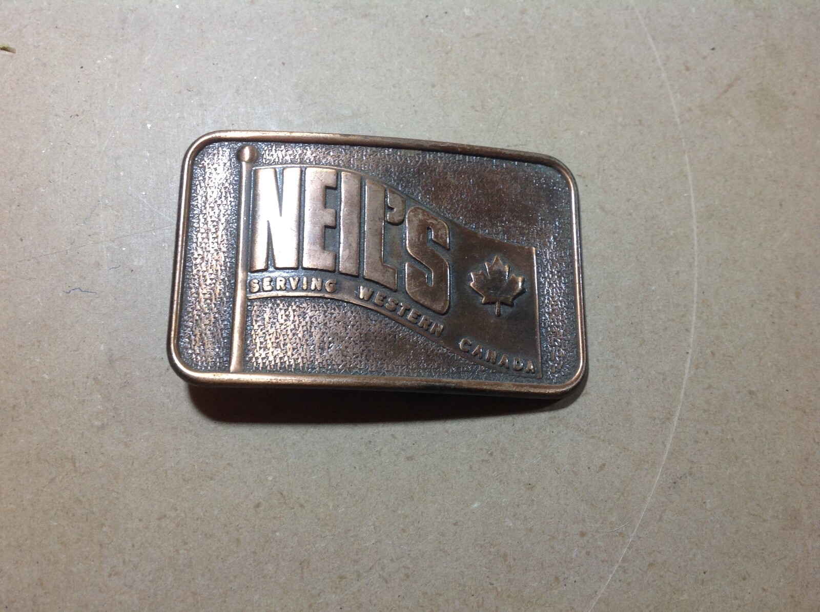 Vintage NEIL'S Serving Westen Canada Belt Buckle - Gem