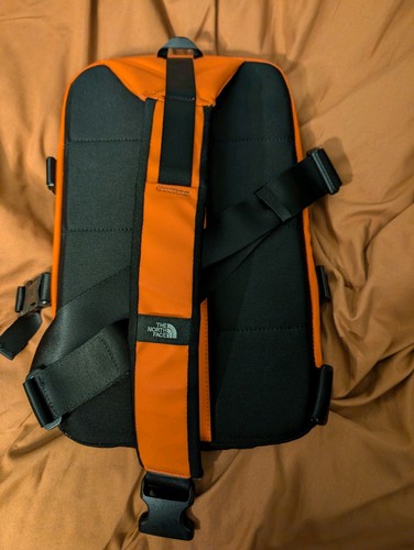 The North Face Body Bag The North Face COMMUTER ALT CARRY PACK - Orange ...