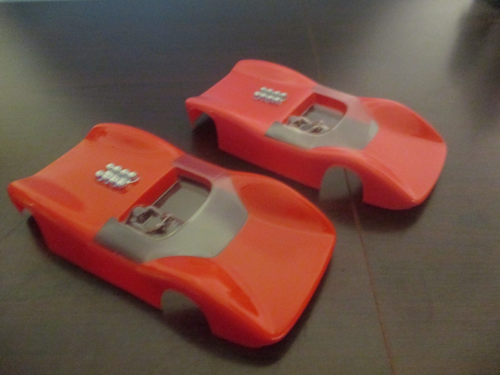 2 vintage 1/24 scale slot car bodys. one red one pink, factory painted ...