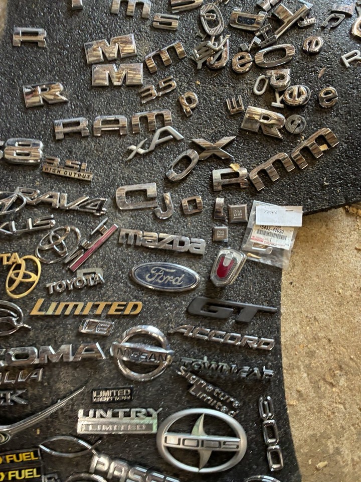 EMBLEMS BADGES LETTERS ASSORTMENT OF OEM EMBLEMS LOT Dodge Ford Toyota ...