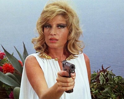Monica Vitti in Modesty Blaise in white dress pointing gun 24x36 inch ...