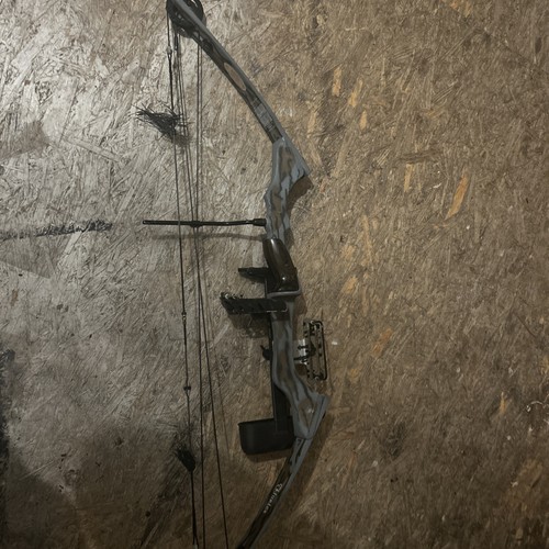 high country compound bow . Used but in good condition. Color is camo ...