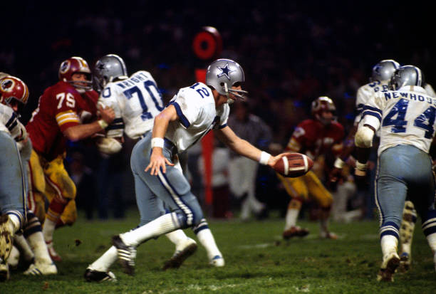 Quarterback Roger Staubach of Dallas Cowboys turns to hand the- 1973 ...