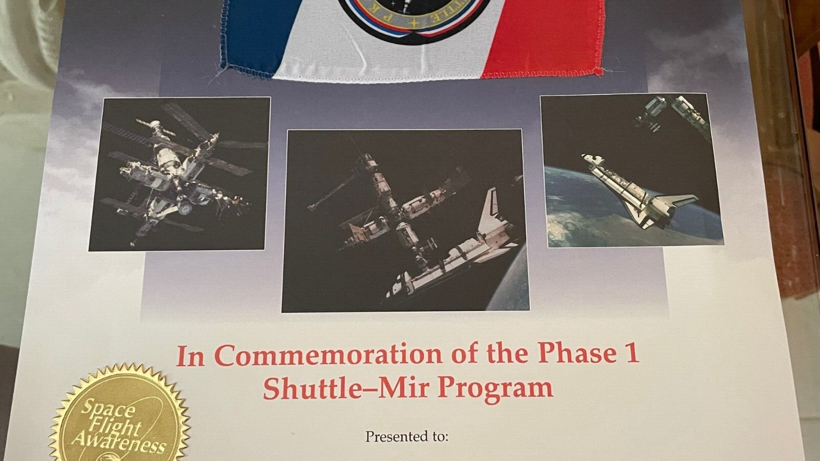 DISCOVERY (STS-91) FLOWN PHASE ONE SHUTTLE-MIR FLAG ON PRESENTATION ...