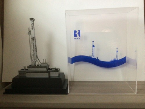 Clear Acrylic Display Box Cover Over a Composite Replica of an Oil Rig ...