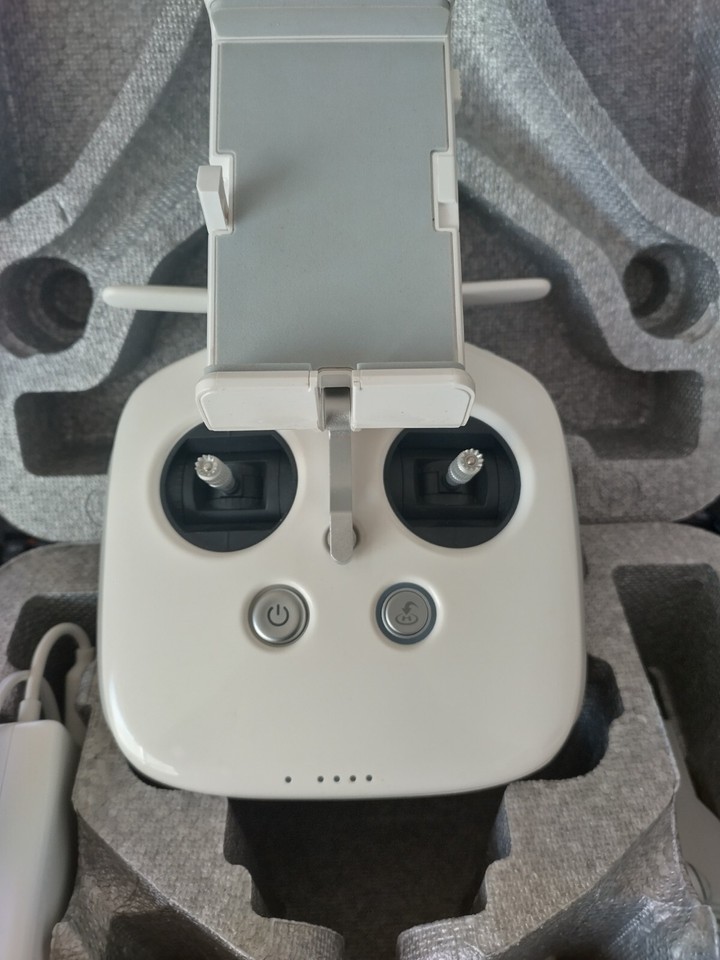 DJI Phantom 4 controller with styrofoam case, charger, and replacement ...