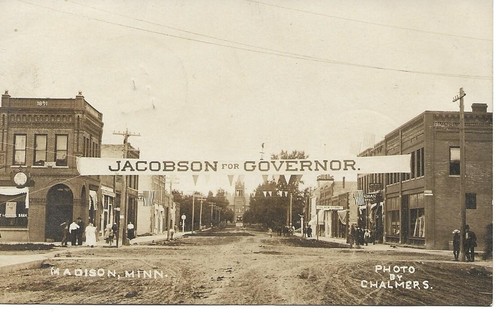 1908 Street Scene Madison Minnesota Jacobson for Governor Banner RPPC ...