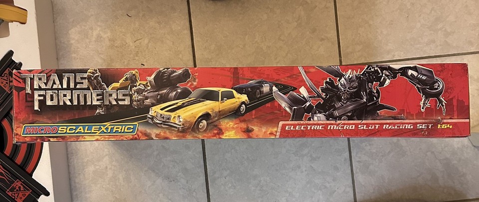 SCALEXTRIC 1/64 TRANSFORMER BUMBLEBEE BARRICADE SLOT CAR RACING SET | eBay