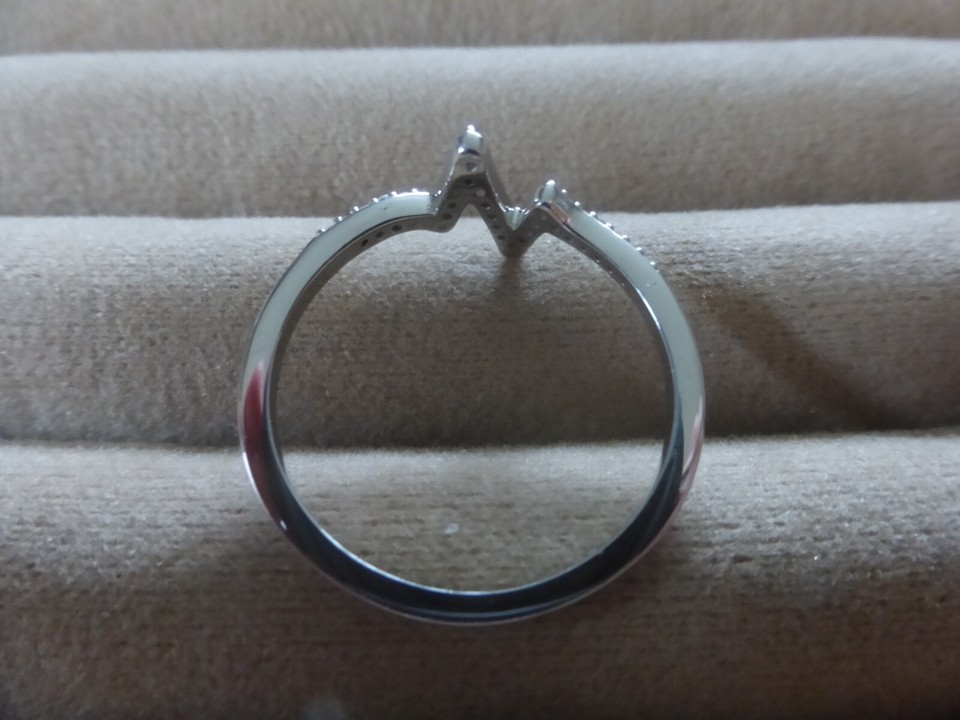 UNUSUAL HEARTBEAT DIAMOND RING. PLATINUM OVER STERLING SILVER. SIZE S ...