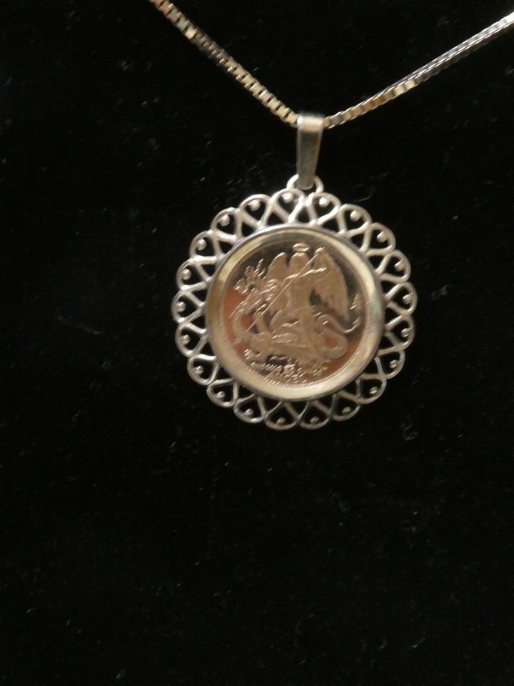 22 CRT. GOLD ANGEL COIN ON NINE CRT GOLD 18" INCH CHAIN. WEIGHT SHOWN ...