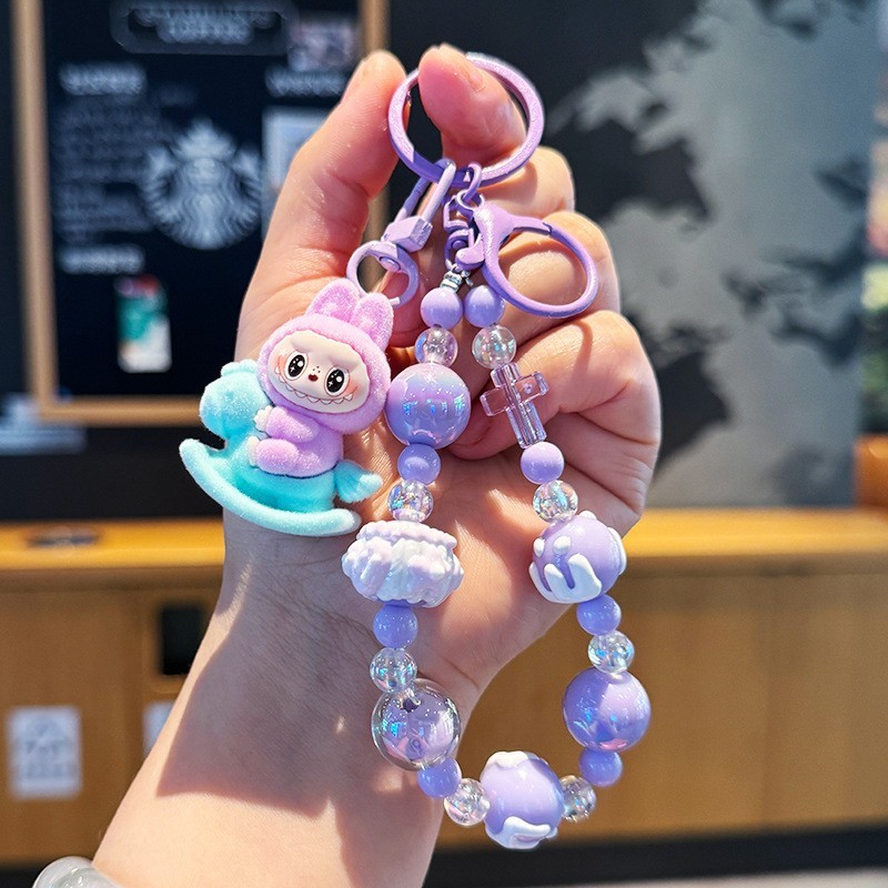 Cute Figure Doll Keychain with String of Beads on Hobbyhorse Bag ...