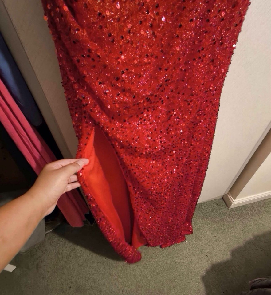 Sparkling red party dress with sequins over shoulders and side split ...