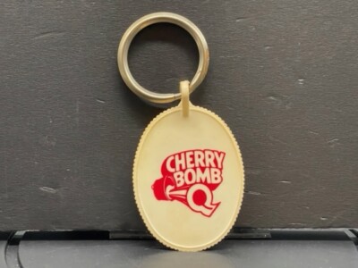 VRHTF "VERY COOL CHERRY BOMB KEY CHAIN" 2" X 1.5" EXCELLENT CONDITION ...