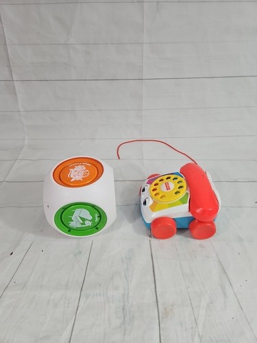 Munchkin Mozart Magic Cube Orchestra And Fisher Price Pull Toy Phone ...