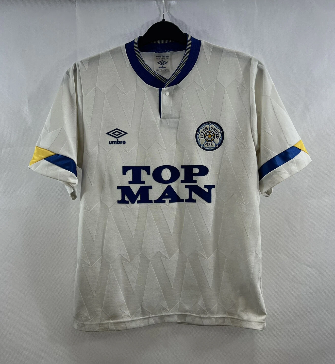 Top Man logo - Marching On Together
