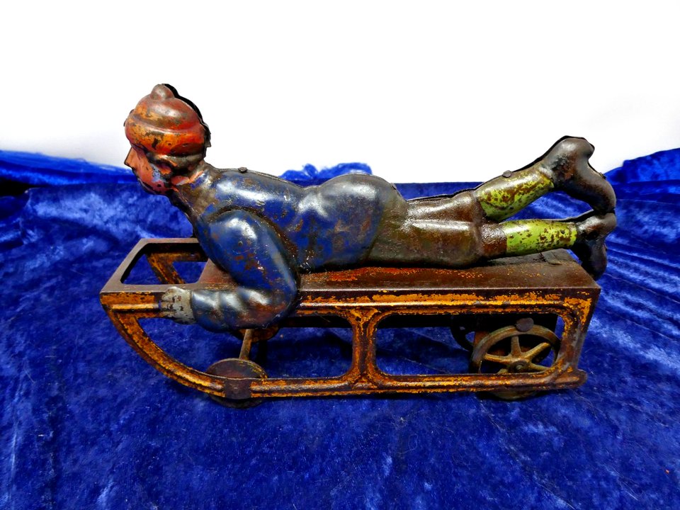 VINTAGE D.P. CLARK & CO. BOY ON SLED TIN FRICTION TOY IN ORIGINAL PAINT ...