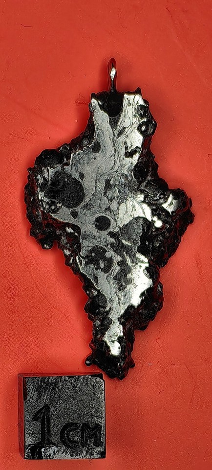 Meteorite.No, it's not a meteorite.It's pure, telluric, very rare earth ...