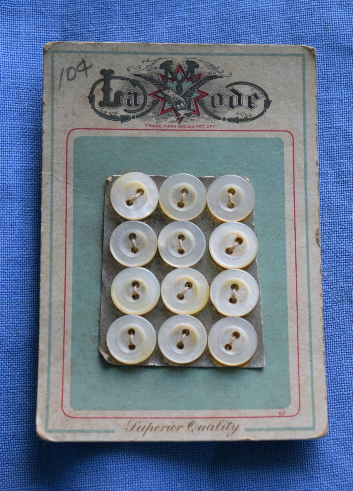 3231 Antique La Mode card 12 shell, MOP buttons, Fancy brand name ...
