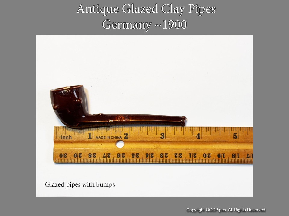 ONE ANTIQUE GLAZED CLAY PIPE WITH BUMPS ON THE BOWL, EARLY 20TH CENTURY ...