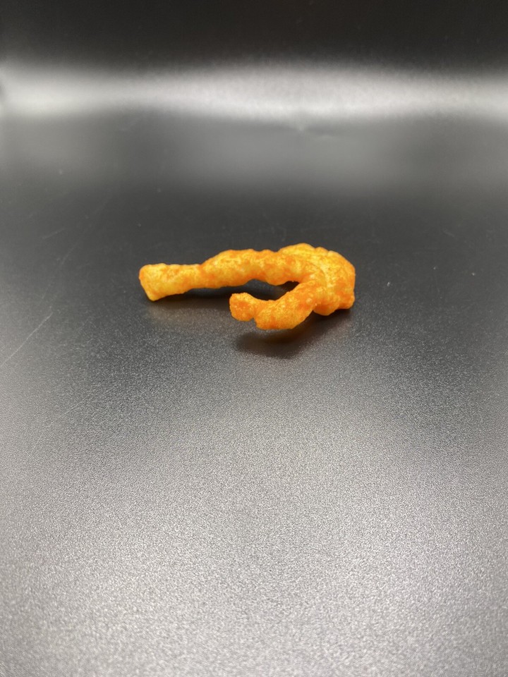 Crunchy Cheeto shaped like a ship’s Anchor or Arrow. | eBay