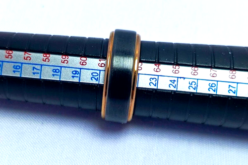 A Men's Wedding Ring Made Of Black Tungsten With Gold Edges Scratch ...