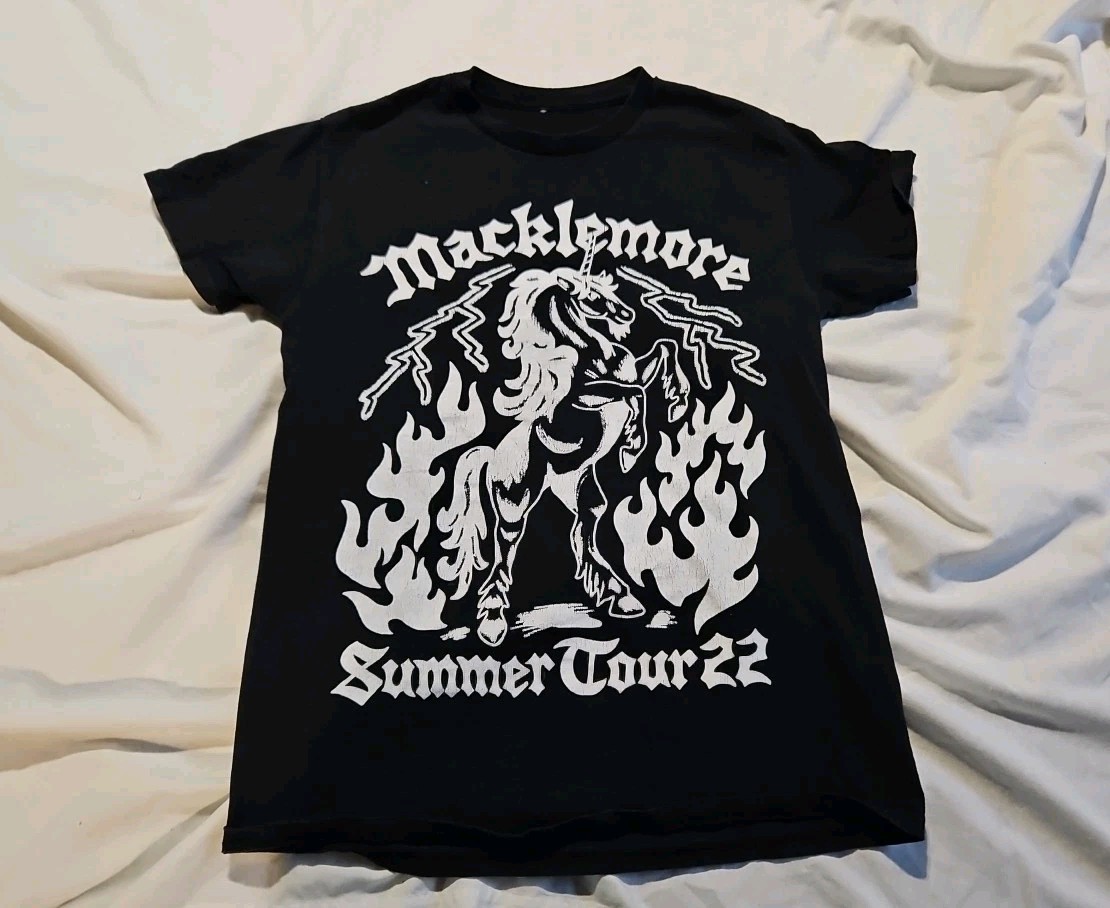 Macklemore Logo Macklemore's 'F Cked Up' Calls Out Societal Ills