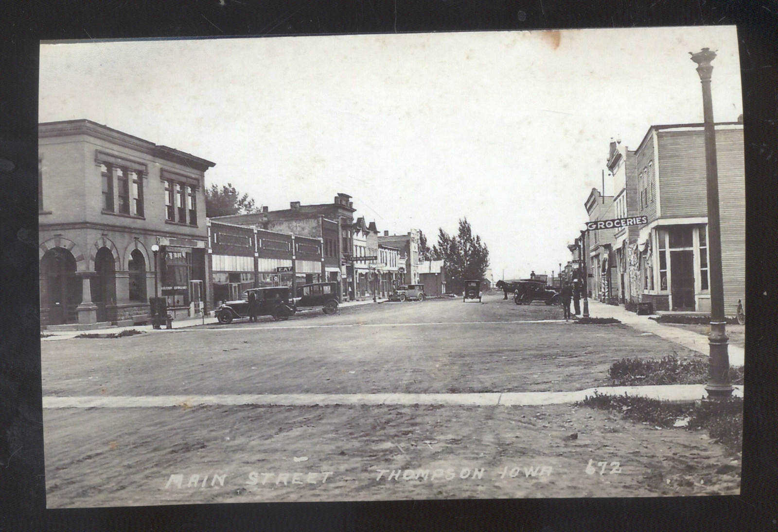 REAL PHOTO THOMPSON IOWA DOWNTOWN STREET SCENE DIRT ROAD POSTCARD COPY ...