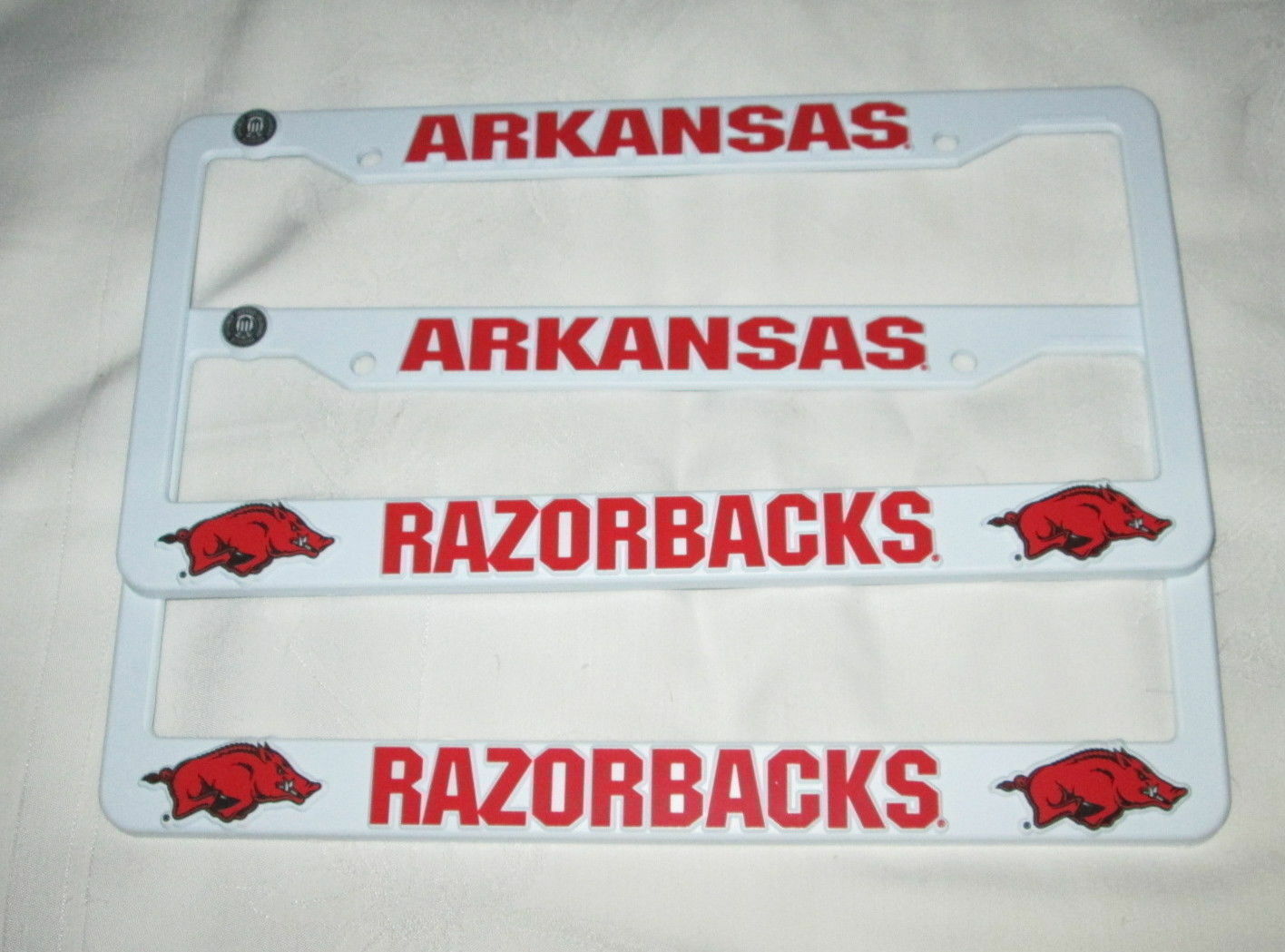 TWO (2) ARKANSAS RAZORBACKS EMBOSSED LICENSE PLATE FRAMES #16a - NEW | eBay