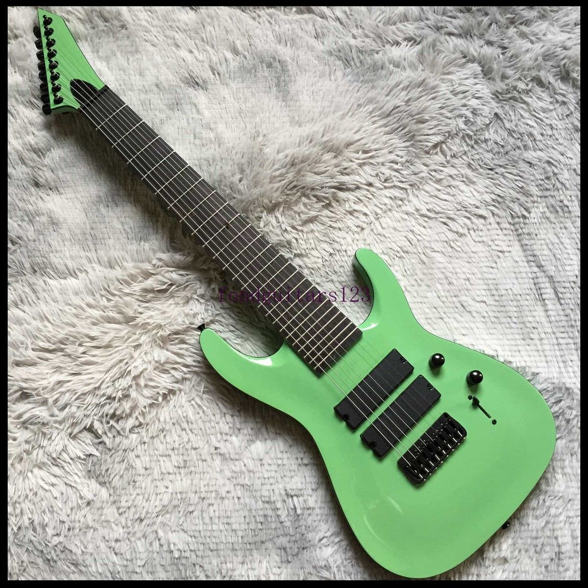 Green And Black Electric Guitar