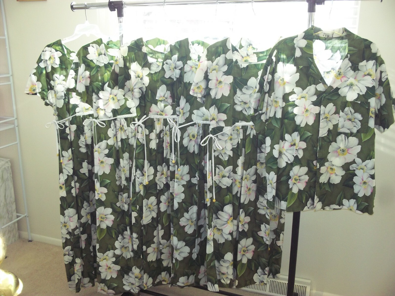 Five matching Hawaiian muu muus and matching men’s sh… - Gem