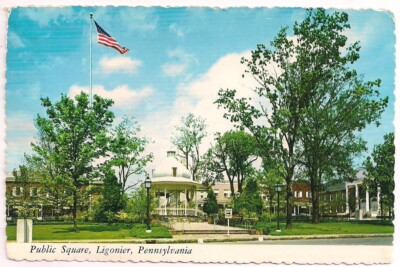 LIGONIER PA Postcard PUBLIC SQUARE Flag & Park PENNSYLVANIA ...