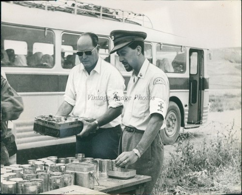 1962 Photo American Canadian Red Cross Workers Feed Algerians Milk ...