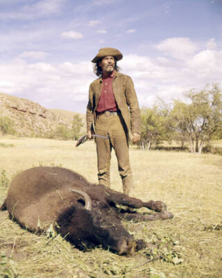 Henry Fonda as Jethro Stuart, standing next to a dead buffalo in '- Old ...
