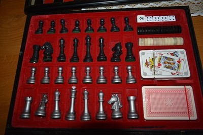 A beautiful multi-game set, primarily featuring chess pieces and ...