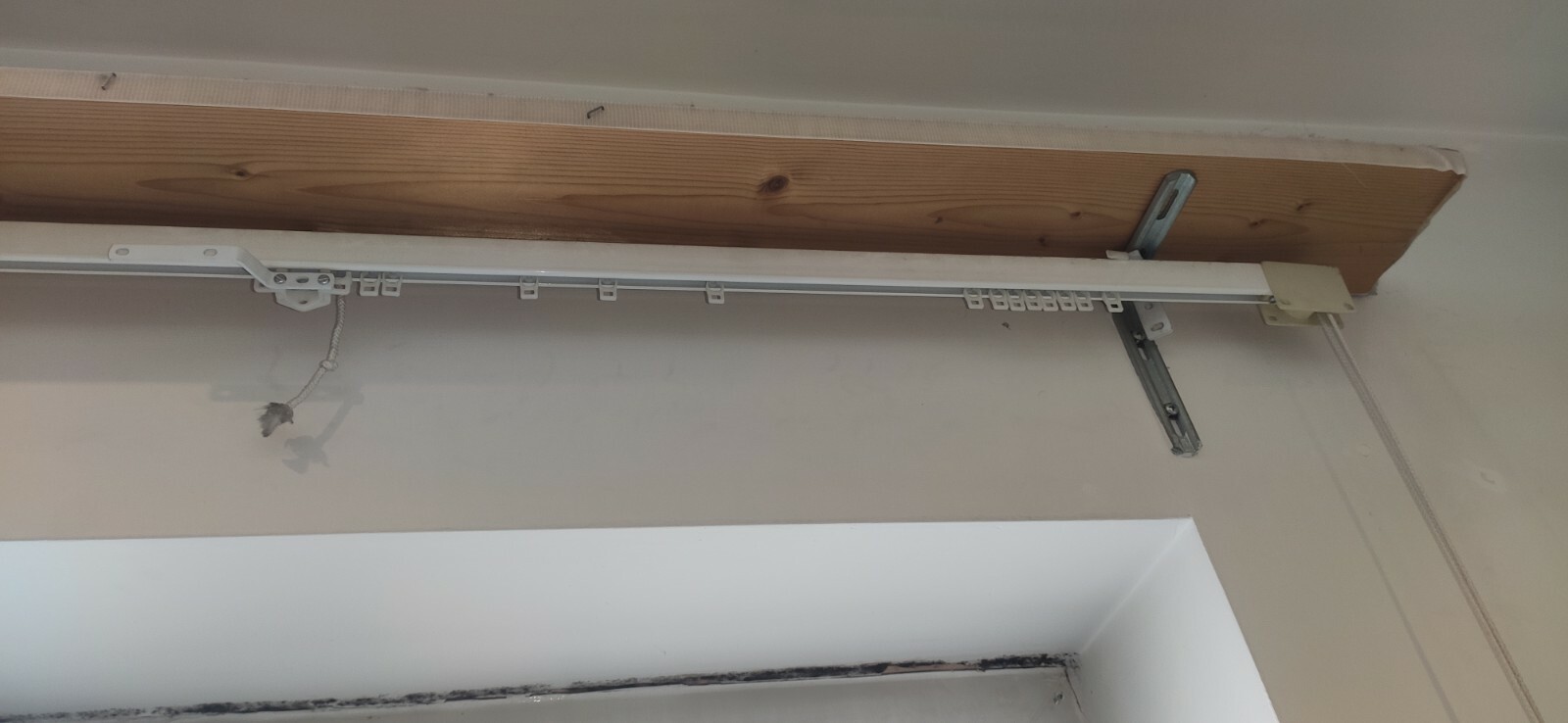 curtain rail track with draw string opening attached to frame for ...