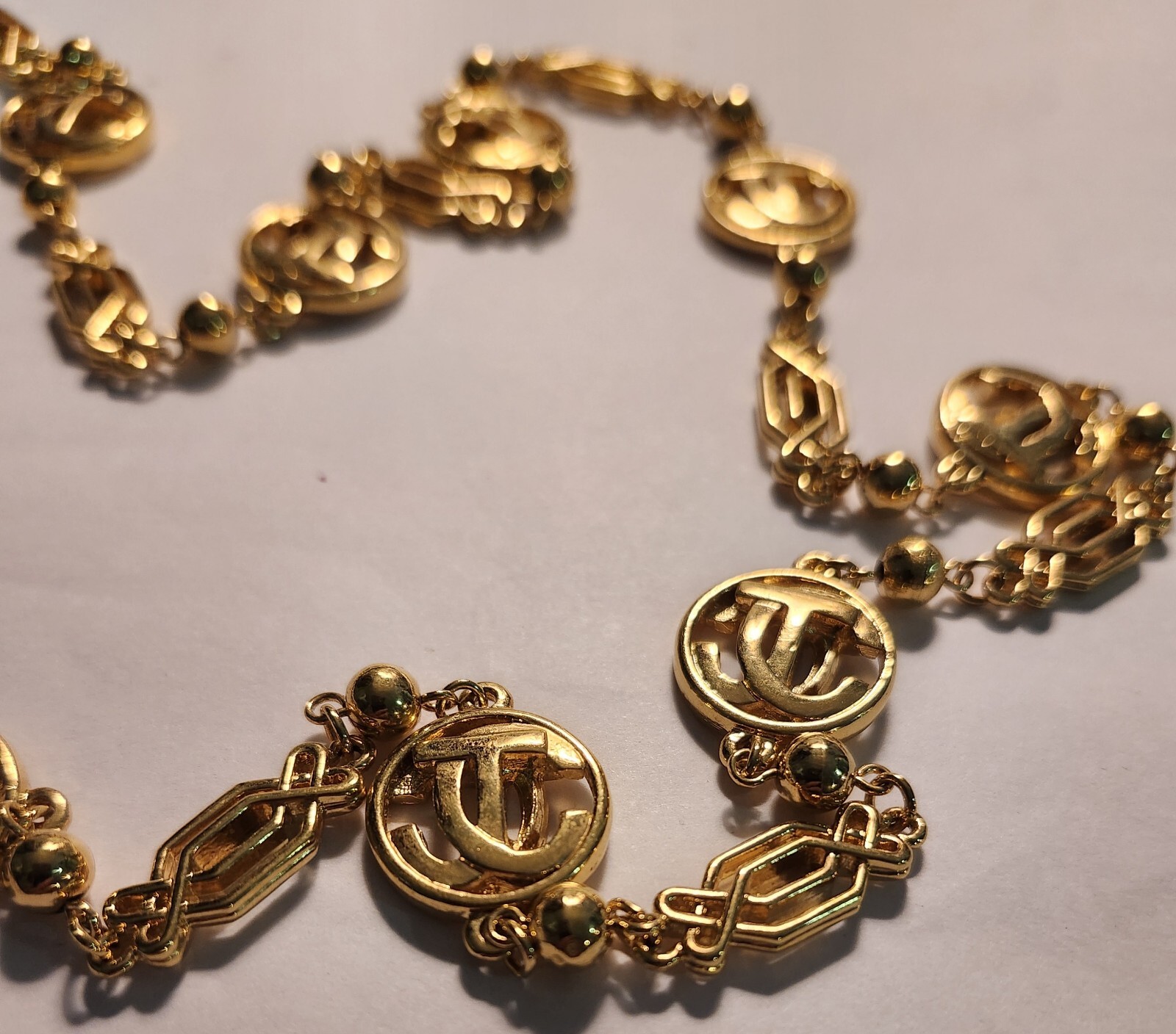 Vintage Joseph Cleary Gold Tone Logo Necklace. 34" - Gem